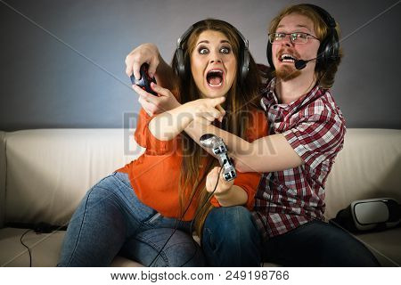 Couple Enjoying Leisure Time By Playing Video Games Together, Man And ...