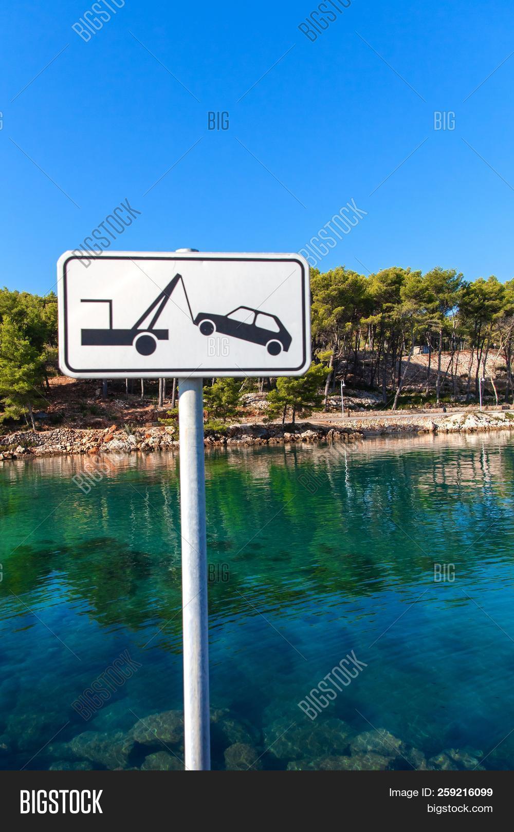 Car Towing Sign By Sea Image & Photo (Free Trial) | Bigstock