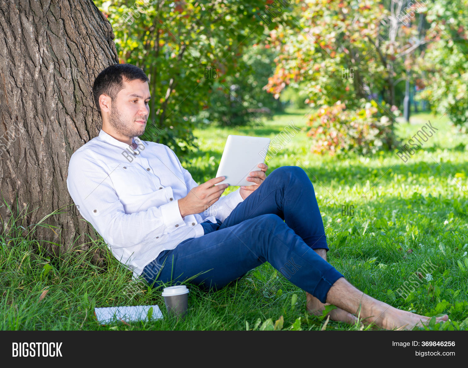 Young Man Using Tablet Image & Photo (Free Trial) | Bigstock