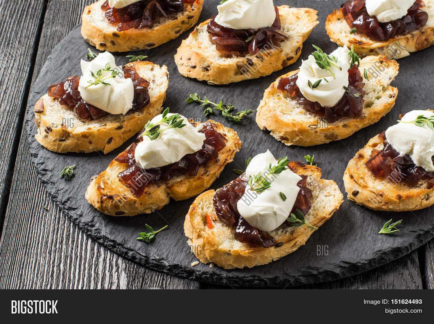 Canape or crostini on slate board. Ideal as an aperitif. Ingredients ...