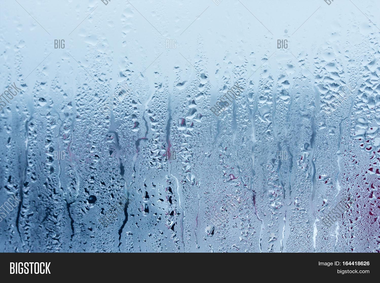 Window glass with condensation, strong, high humidity in the room ...