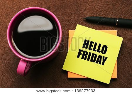 Hello Friday - text on sticky note with a pen and cup of coffee Stock ...