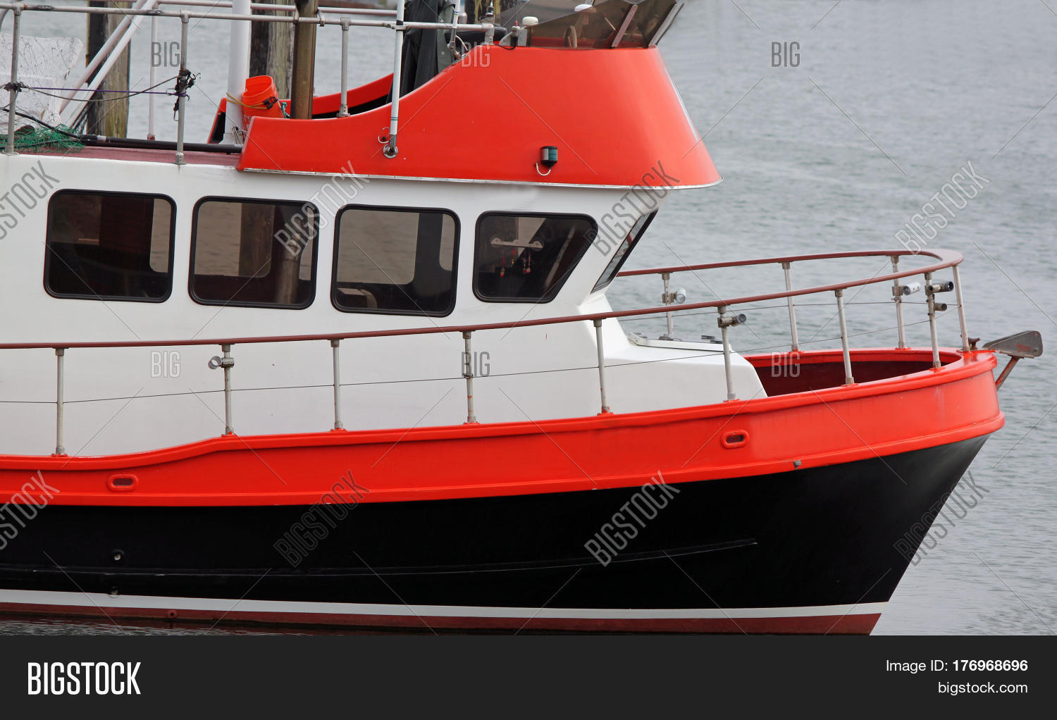 Red White and Black Fishing Boat in the harbor Stock Photo & Stock ...