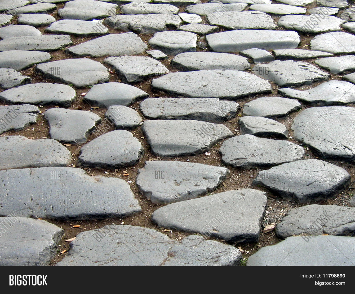 Ancient Roman Road Pavement Of Large Stones In Rome Stock Photo & Stock ...