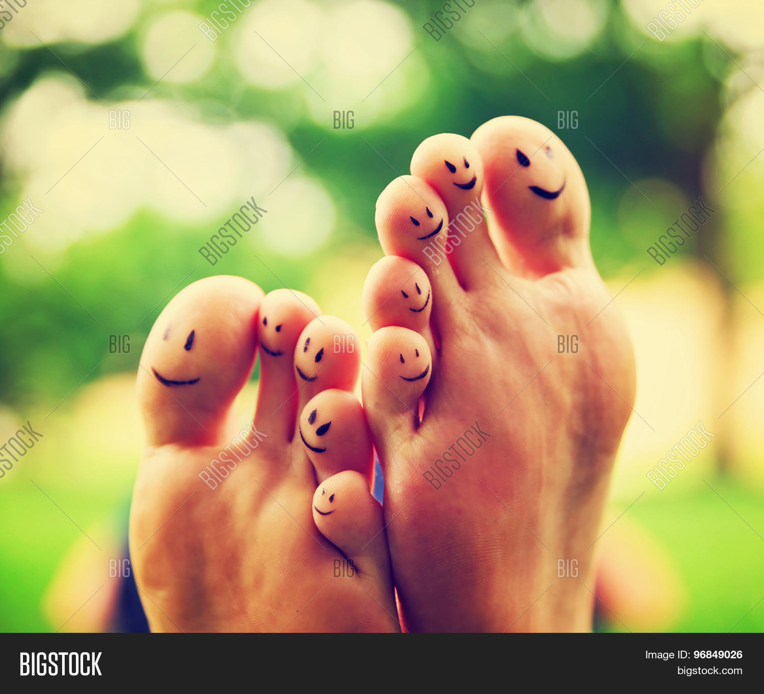 smiley faces on a pair of feet on all ten toes (VERY SHALLOW DOF - big ...