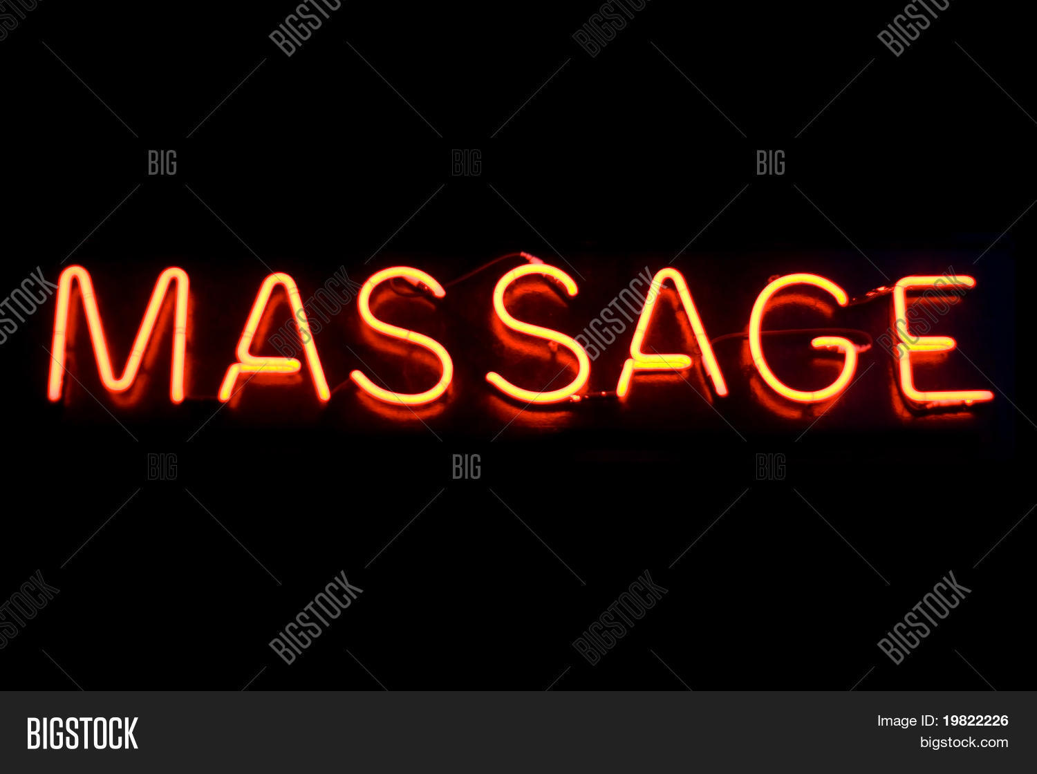 Red neon sign of the word 'Massage' on a black background. Stock Photo ...